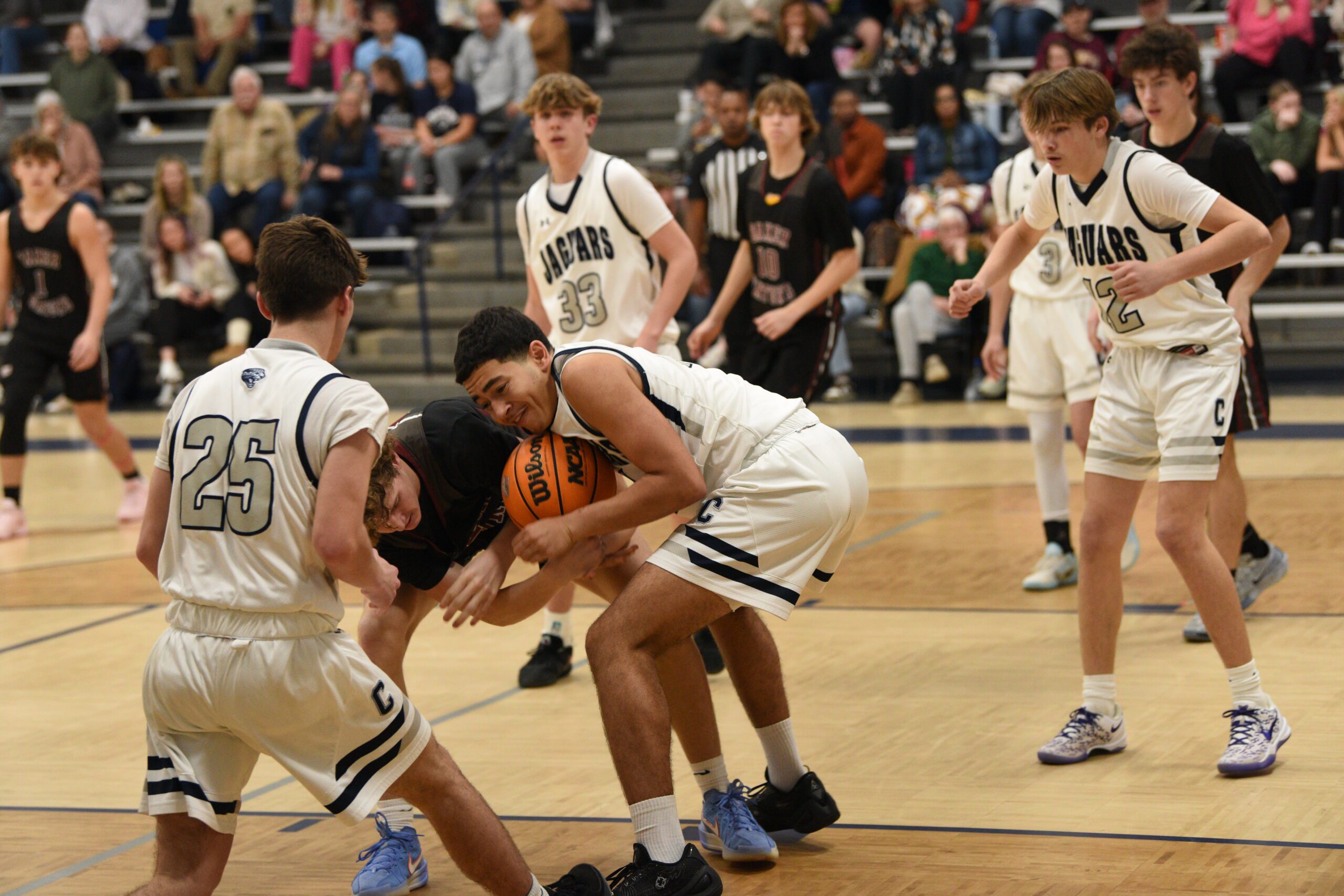 Central boys basketball team battles Baker tough in district loss ...